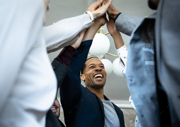 Team making a high five Stock Photo by Rawpixel | PhotoDune