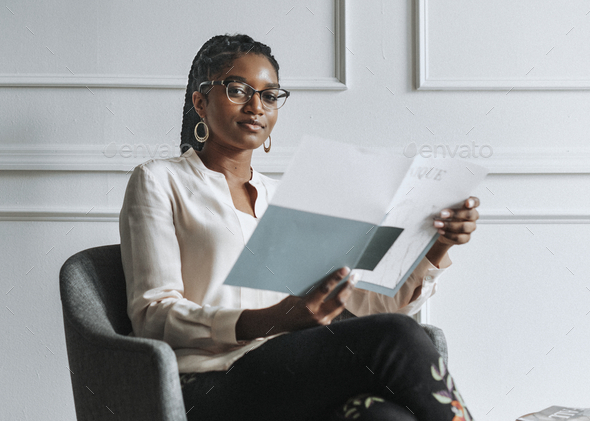 Woman reading a brochure Stock Photo by Rawpixel | PhotoDune