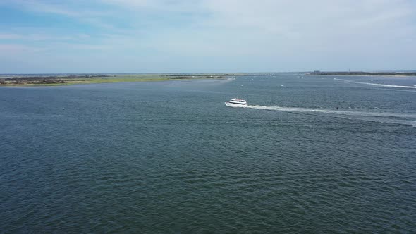 An aerial drone view over Jones Inlet on a sunny day. The camera dolly ...