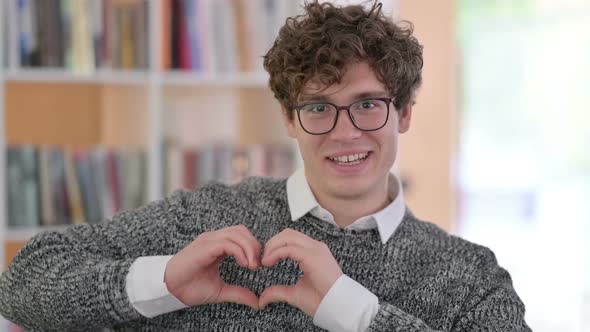 Portrait of Young Man with Heart Sign By Hand, Stock Footage | VideoHive