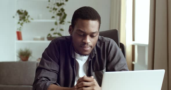 Serious African American Black Man Looking at Laptop Screen with ...