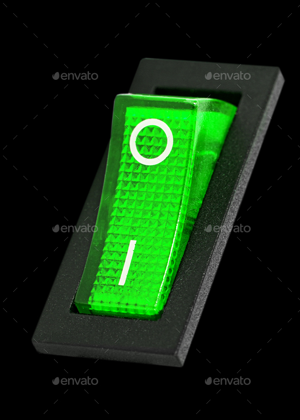 Green power switch at ON position, isolated on black background Stock ...