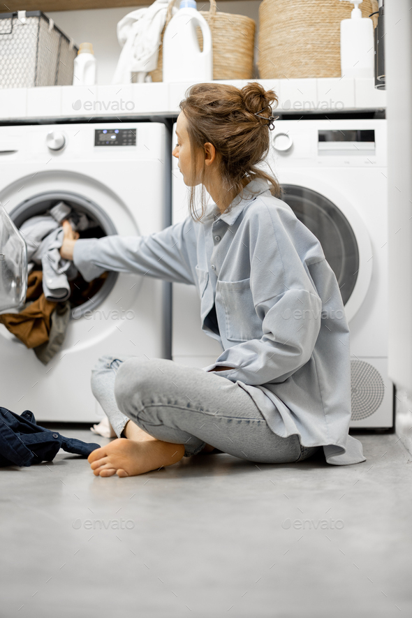 Woman washing clothes at home Stock Photo by RossHelen | PhotoDune