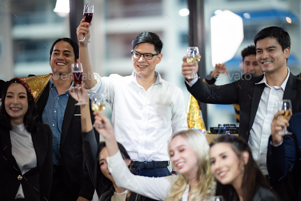 Toast to success. Group of business people toasting with champagne and ...