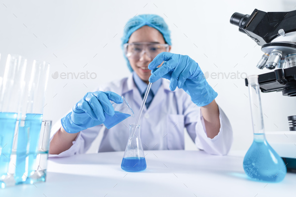 scientist with equipment and science experiments, laboratory glassware ...