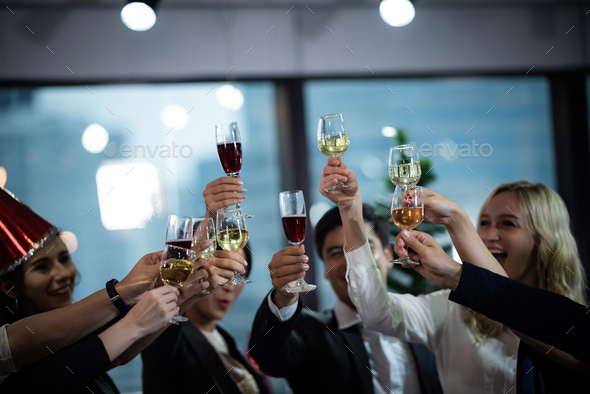 Toast to success. Group of business people toasting with champagne and ...