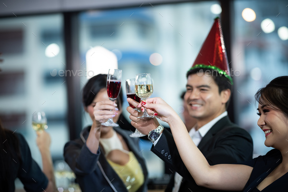 Toast to success. Group of business people toasting with champagne and ...