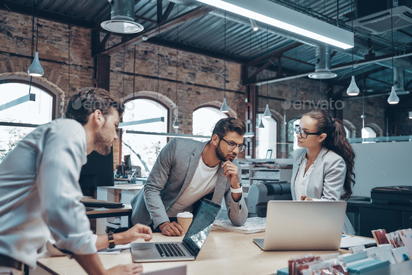 Group of young modern people in smart casual wear Stock Photo by ...