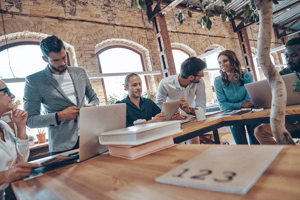 Group of young modern people in smart casual wear Stock Photo by ...