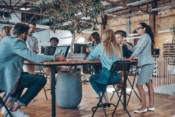 Group of young modern people in smart casual wear Stock Photo by ...