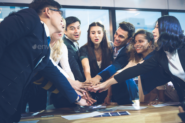 Business cooperation A group of business people showing cooperative ...