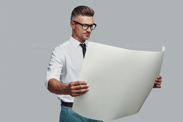 Checking every detail. Stock Photo by gstockstudio | PhotoDune