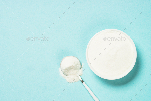 Collagen powder dietary supplement at blue. Stock Photo by Nadianb