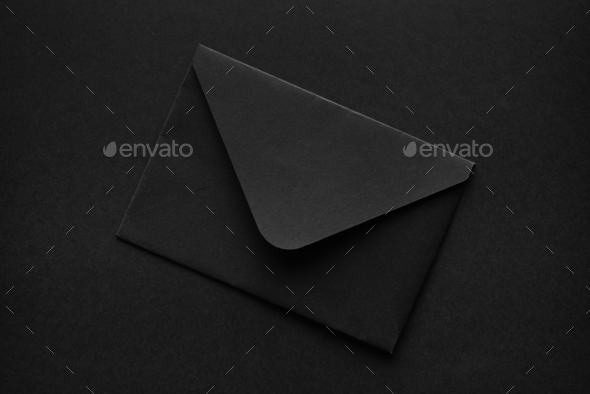 Black envelope on a black background. Stock Photo by wolfhound9111