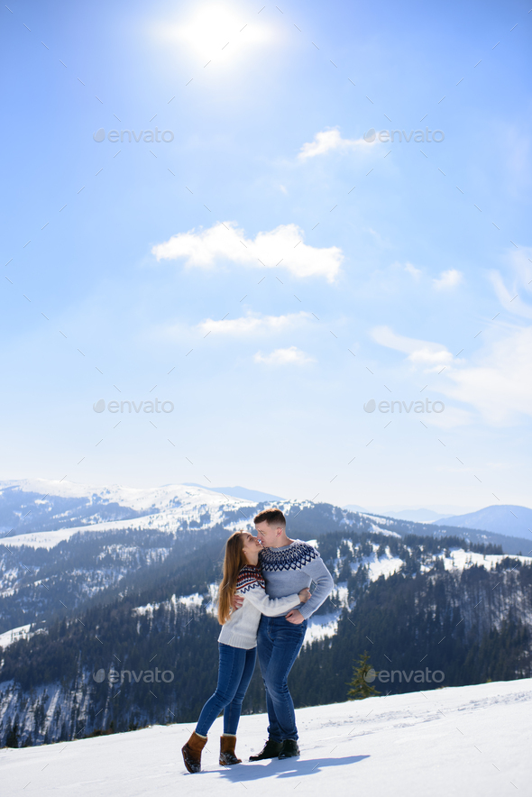 Loving couple playing together in snow outdoor. Stock Photo by ...