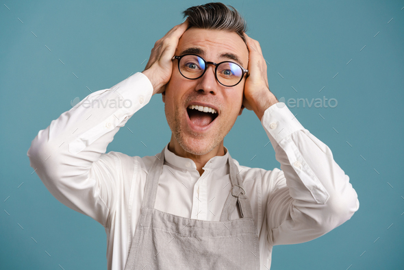 Delighted grey-haired man exclaiming and grabbing his head Stock Photo ...