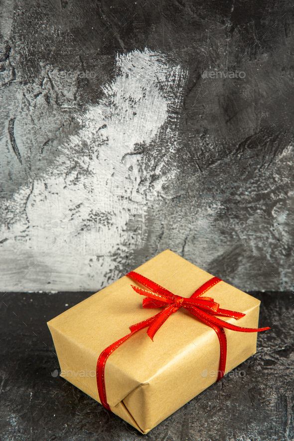 front view mini gift with red ribbon on dark isolated background free ...