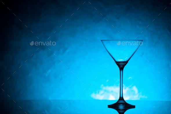 Front close view of glass goblet for wine standing on the left side on ...