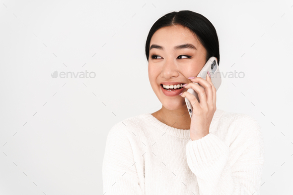 Asian laughing nice girl laughing while talking on mobile phone Stock ...