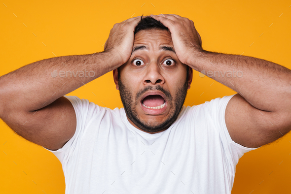 Asian young unshaven scared man grabbing his head Stock Photo by ...