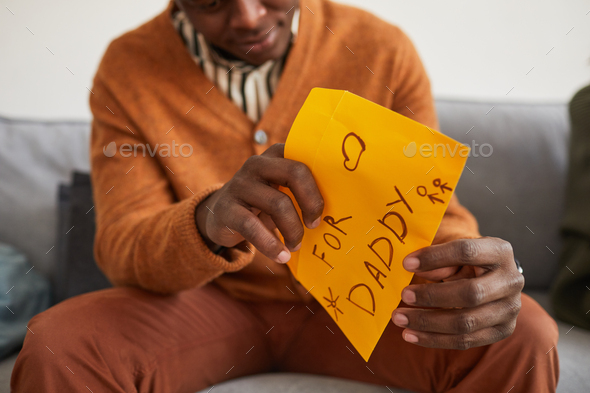 Man Opening Letter from Son Stock Photo by seventyfourimages | PhotoDune