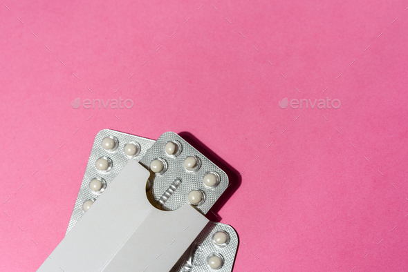 Birth control pills on pink Stock Photo by molenira | PhotoDune