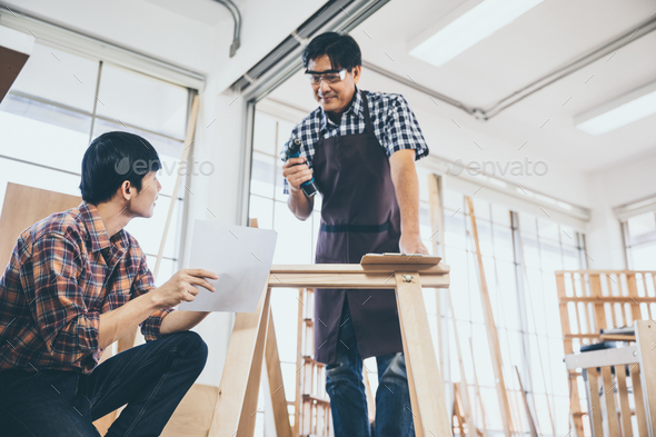 Carpenters team work together creatively, creative carpenter working ...