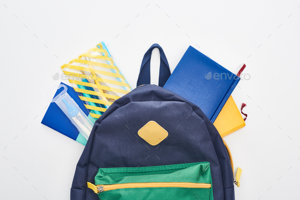 Blue school bag with different school supplies isolated on white Stock ...