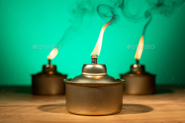 Pelita or oil lamp, traditional Malay oil lamp lit up with smoke during ...