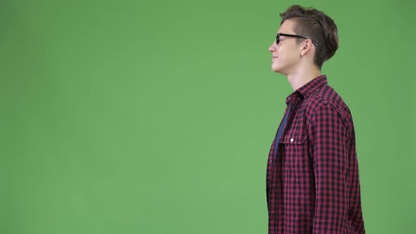 Profile View of Young Handsome Teenage Nerd Boy Smiling, Stock Footage