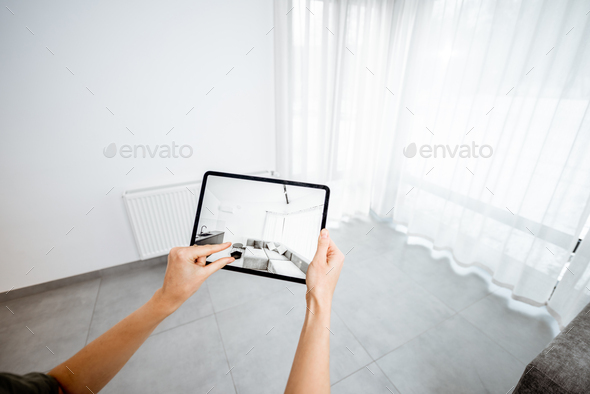 Using augmented reality to design interior Stock Photo by RossHelen