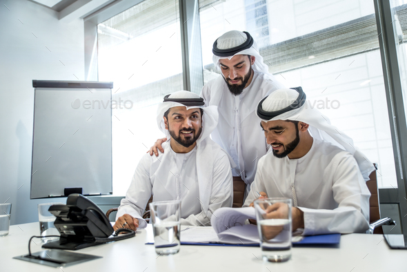 Arabic business team in the office Stock Photo by oneinchpunchphotos