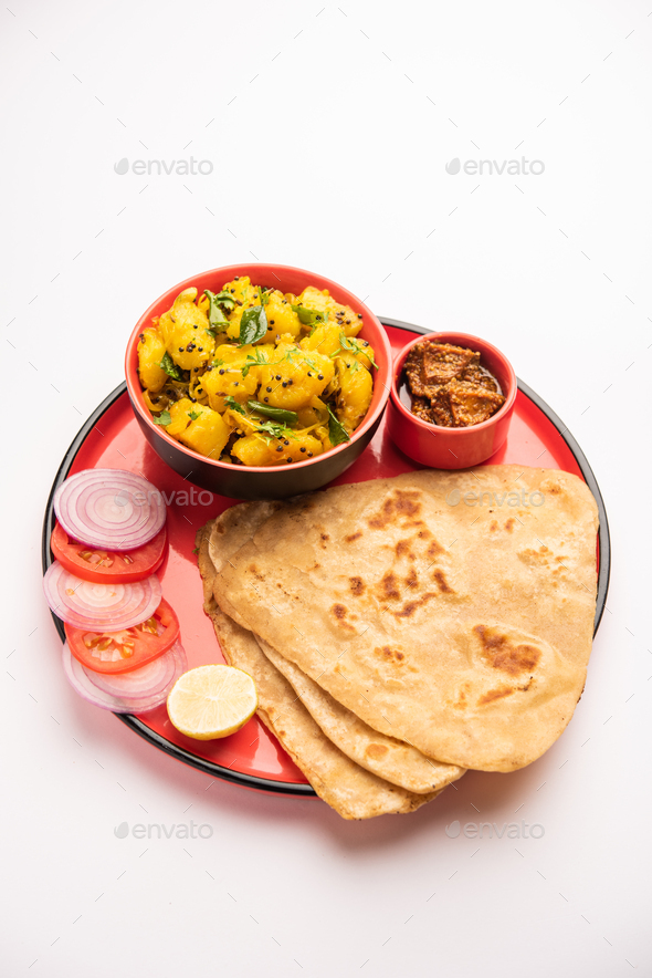 Potato or Aloo Sabji with Triangle Paratha. Indian food Stock Photo by ...