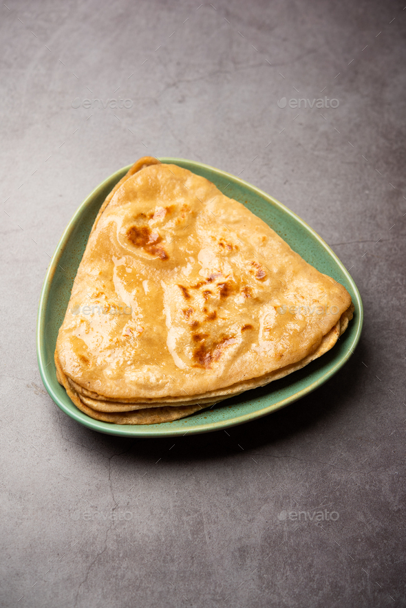 Triangle shape parantha or paratha is an Indian flat bread made with ...