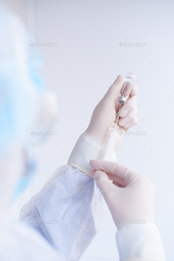 Doctor with injection medicine Stock Photo by viktoriian | PhotoDune