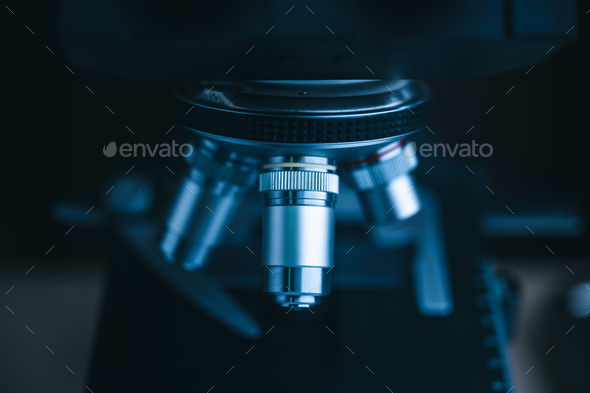 Focus on microscope with metal lens for experiments Stock Photo by ...