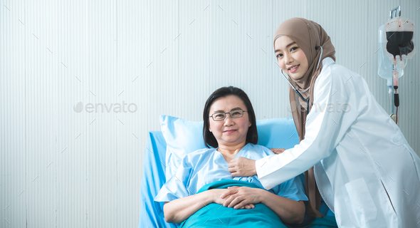 The beautiful Muslim doctor wear hijab works at the hospital to take ...