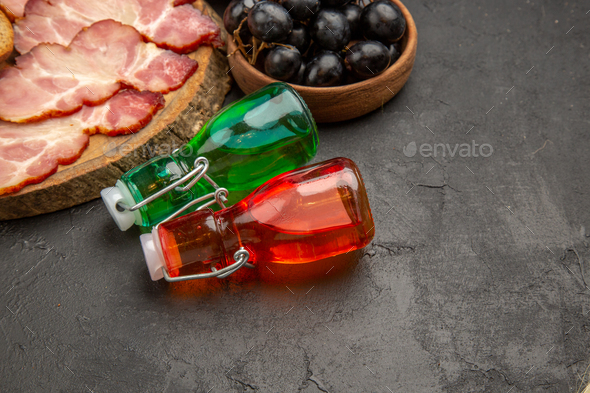 front view fresh sliced ham with buns fruits and bread slices on the ...