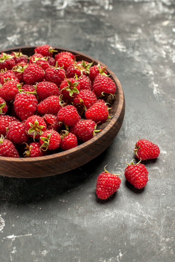 front view fresh red raspberries inside plate on grey background photo ...