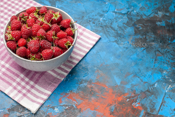 front view red raspberries inside plate on blue background wild photo ...