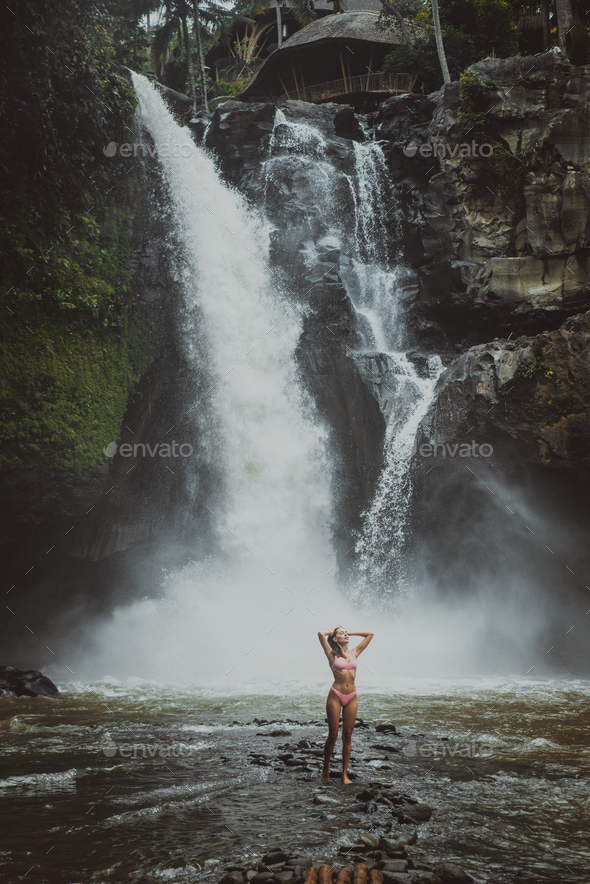 Pretty girl at Tegenungan Waterfall, Bali Stock Photo by oneinchpunchphotos