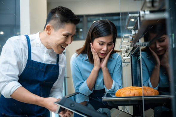 People bake bread in the oven at home Stock Photo by ckstockphoto ...