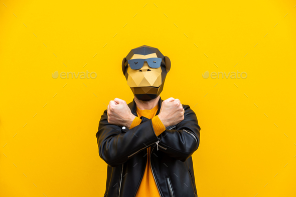 Man with funny low poly mask on colored background Stock Photo by ...