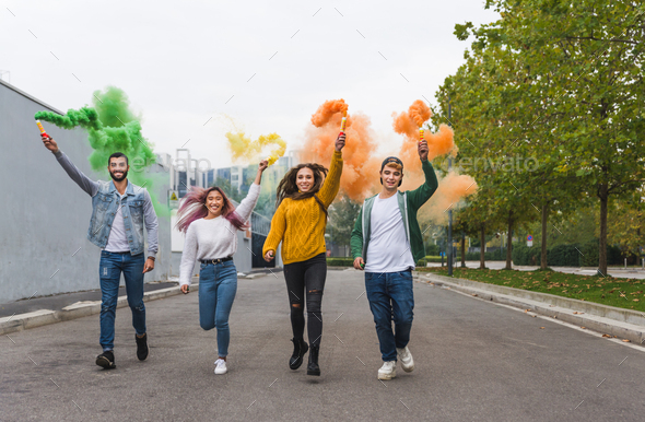 Group of young students bonding outdoors Stock Photo by oneinchpunchphotos