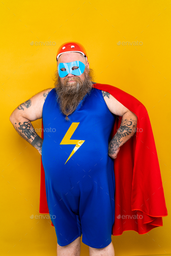 Funny fat man with superhero costume Stock Photo by oneinchpunchphotos