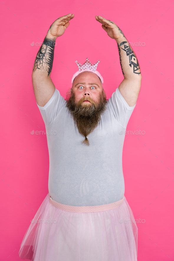 Funny fat man dressed like ballerina Stock Photo by oneinchpunchphotos