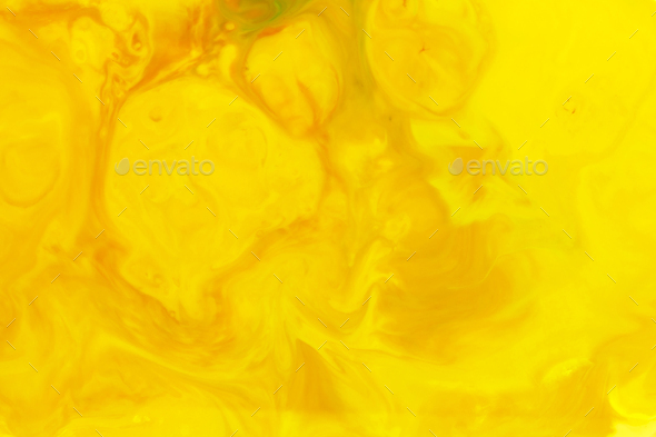 Vibrant yellow abstract amorphous background of swirling ink Stock ...