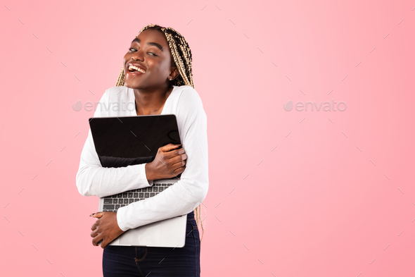 Technology Lover. Excite black woman hugging personal laptop computer ...