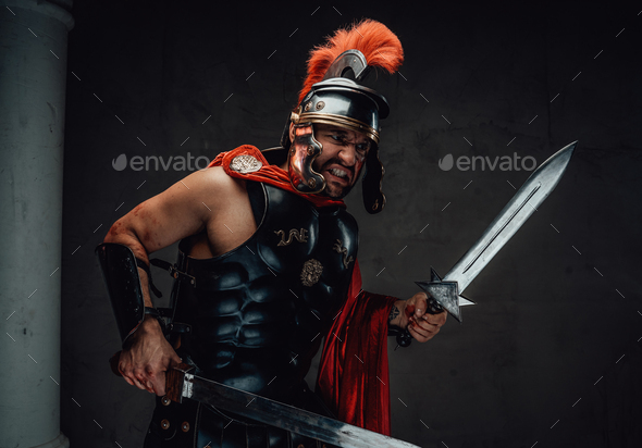 Angry armoured roman soldier with dual swords attacks Stock Photo by ...