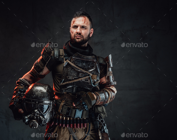 Apocalyptic survivor posing with helmet in dark background Stock Photo ...